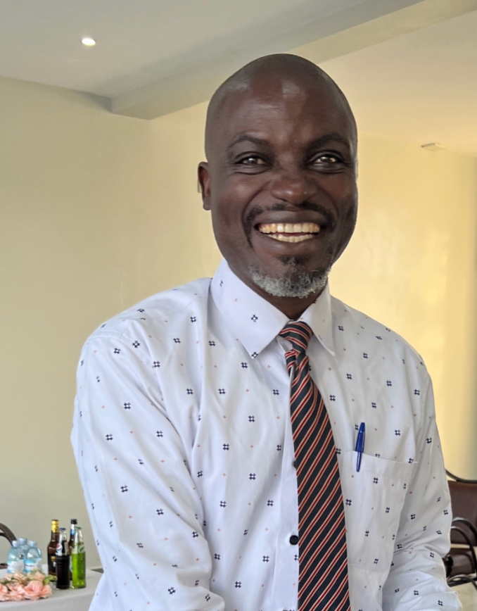 Headteacher Peter's Unstoppable Smile | Real Partners Uganda, Inc.